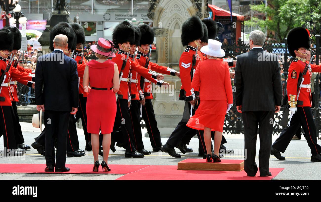 Queen Elizabeth II stands next to Canadian Prime Minister Stephen ...