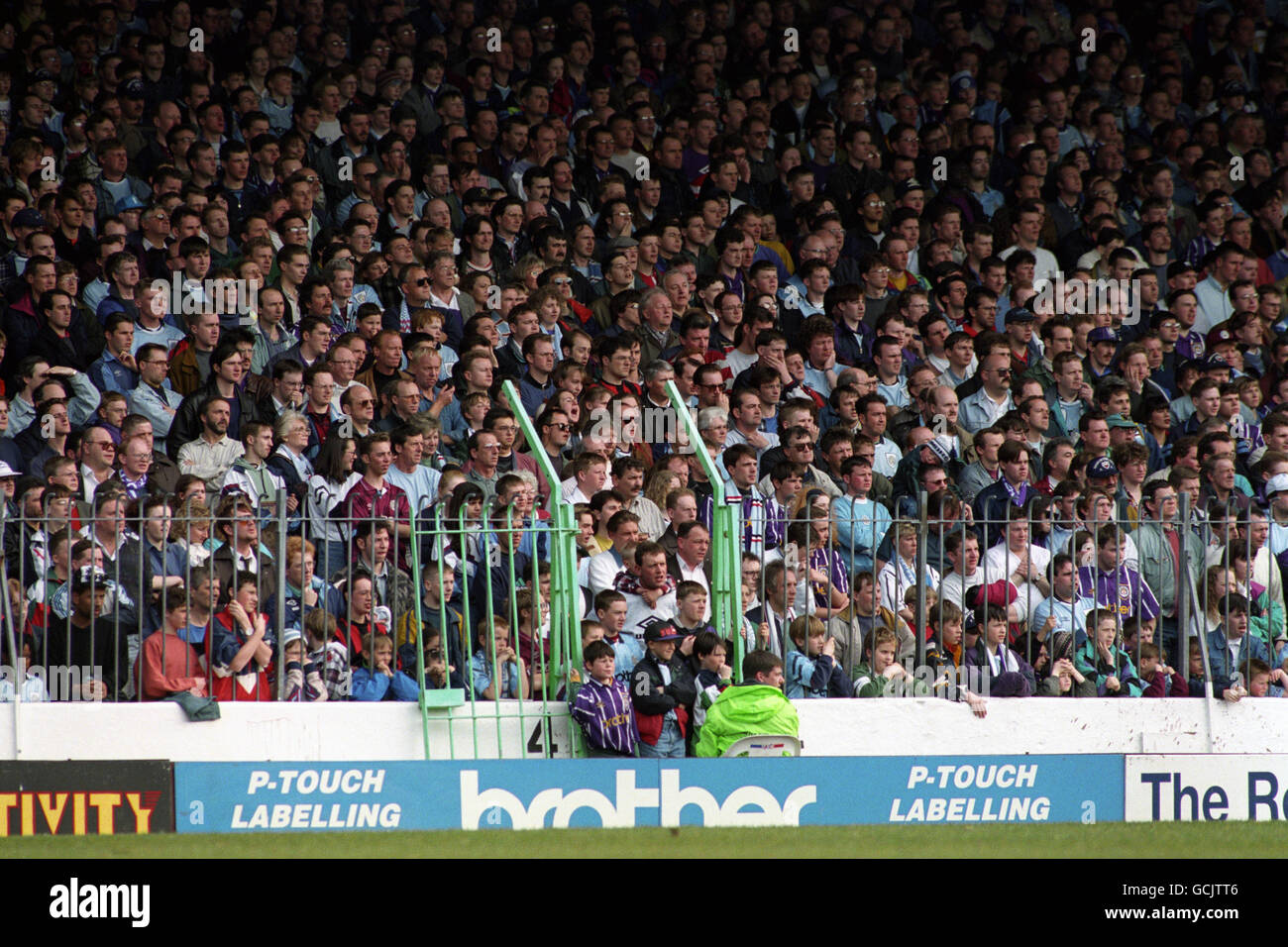 Manchester city fans on the kippax stand hi-res stock photography and ...