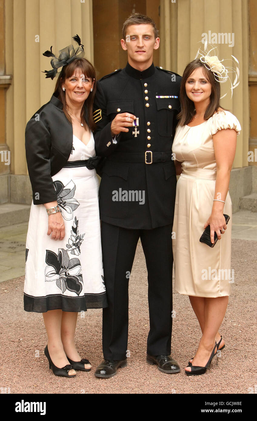 Lance Sergeant Matthew Turrall, of the Irish Guards, stands with his ...