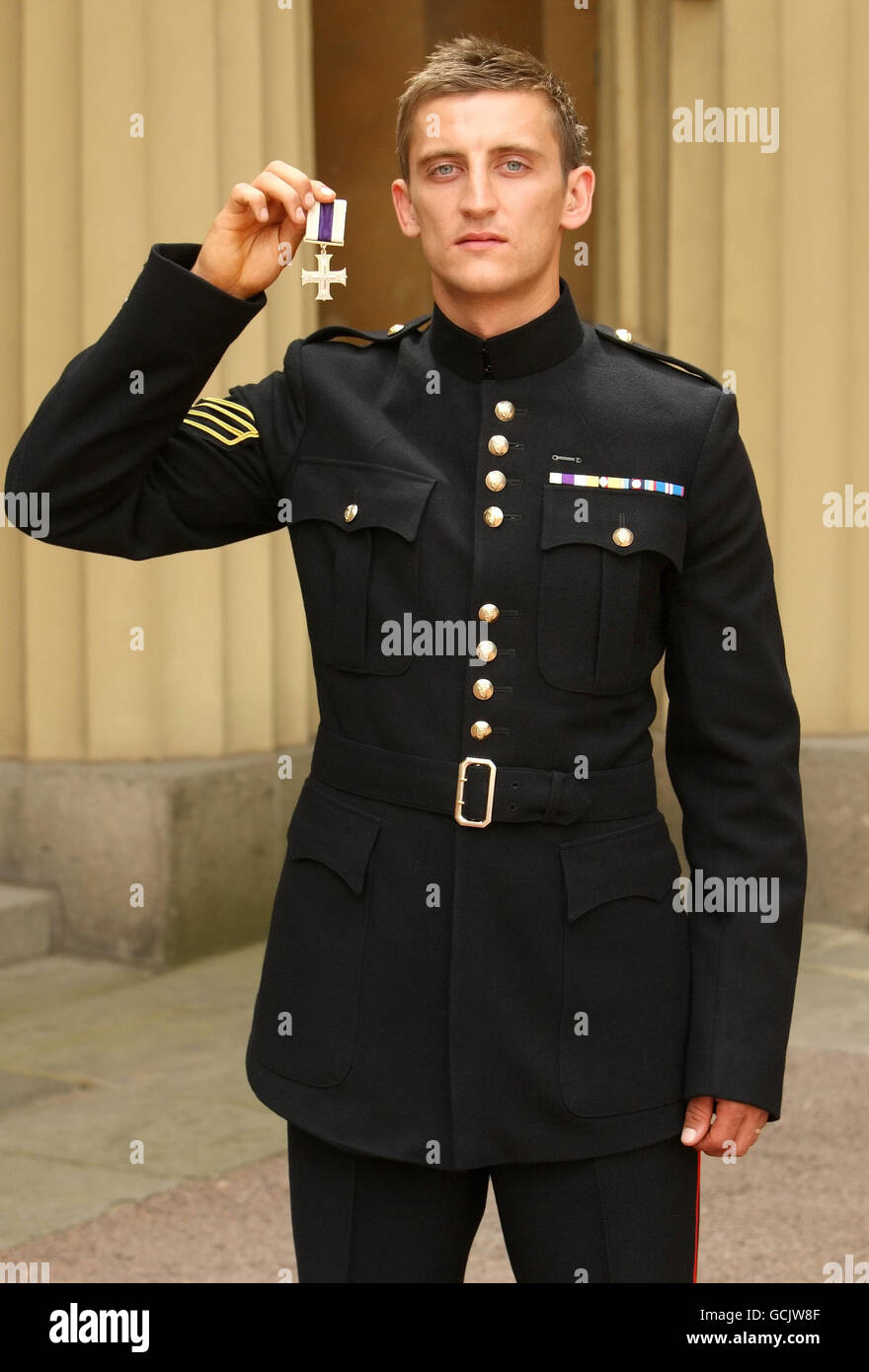 Lance Sergeant Matthew Turrall, of the Irish Guards, holds the Military ...