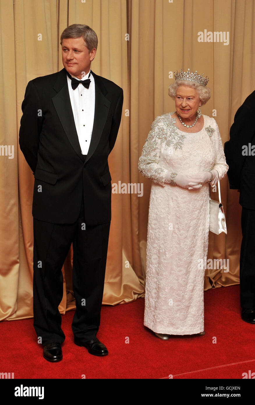Queen Elizabeth II and the Canadian Prime Minister Stephen Harper wait ...
