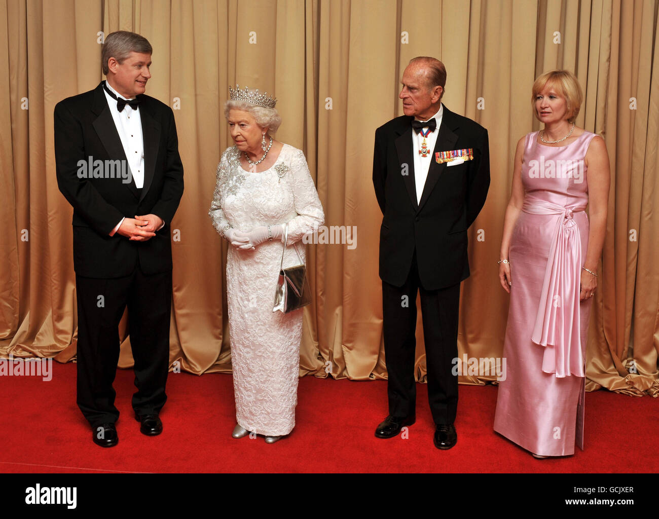Queen Elizabeth II waits with Canadian PM Stephen Harper (left), the ...
