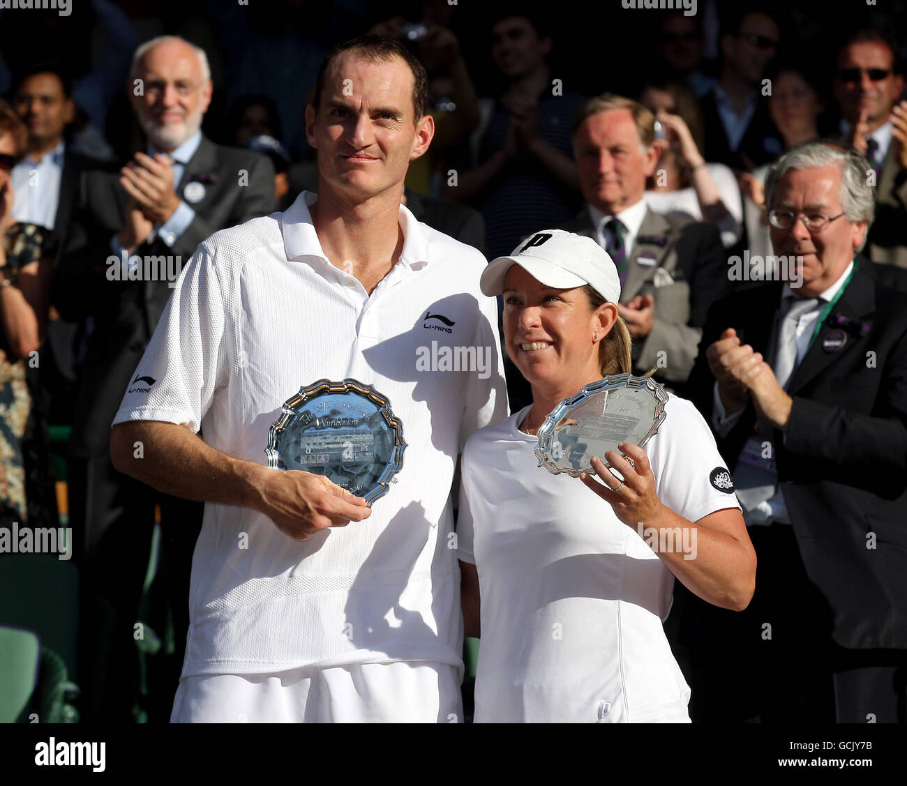 South Africa's Wesley Moore (left) and USA's Lisa Raymond collect their ...