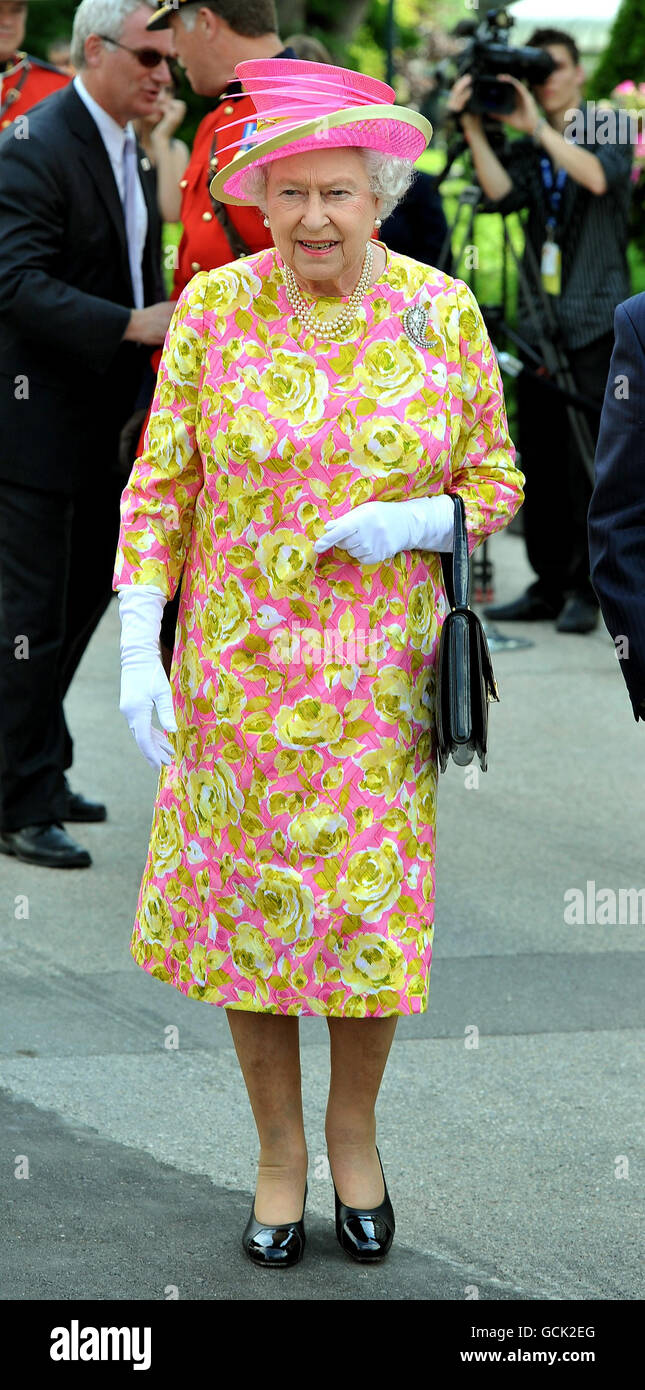 Britain's Queen Elizabeth II walks out of Government House as she makes ...
