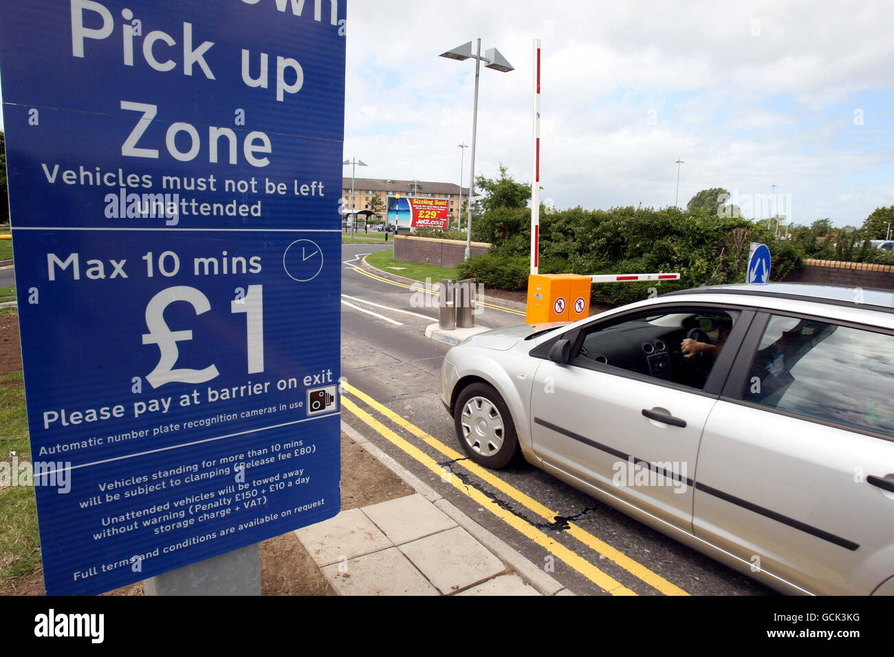 A car passes a sign for the 1 toll for dropping off passengers at ...