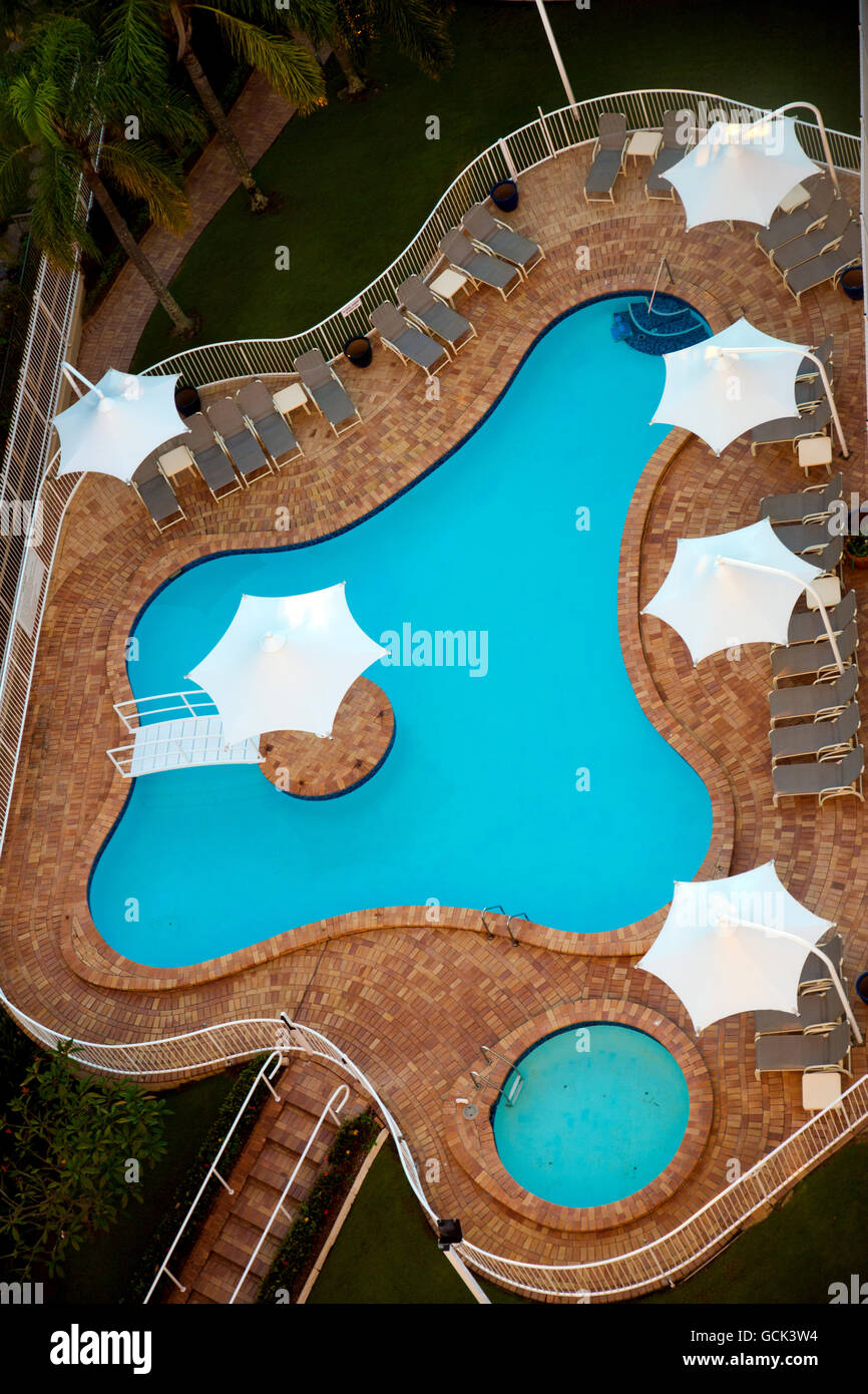 Swimming pool with umbrellas Stock Photo - Alamy