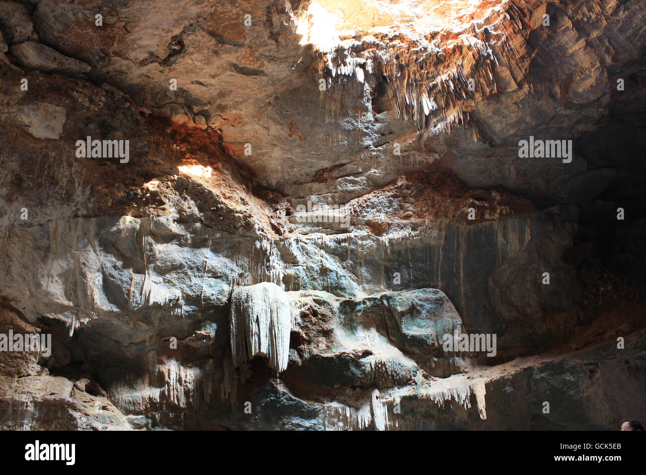 Colorful cave stalactites formation. Close up of colorful natural ...