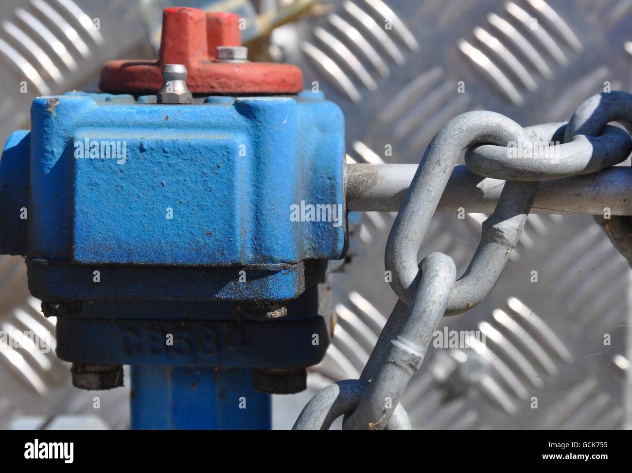 Closeup abstract of industrial utility meter painted in bright blue and ...