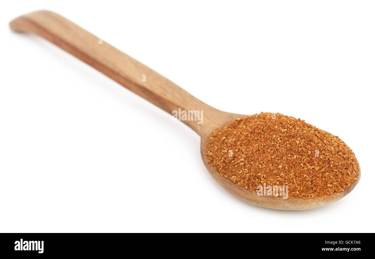 Crushed cumin in a wooden spoon over white background Stock Photo - Alamy