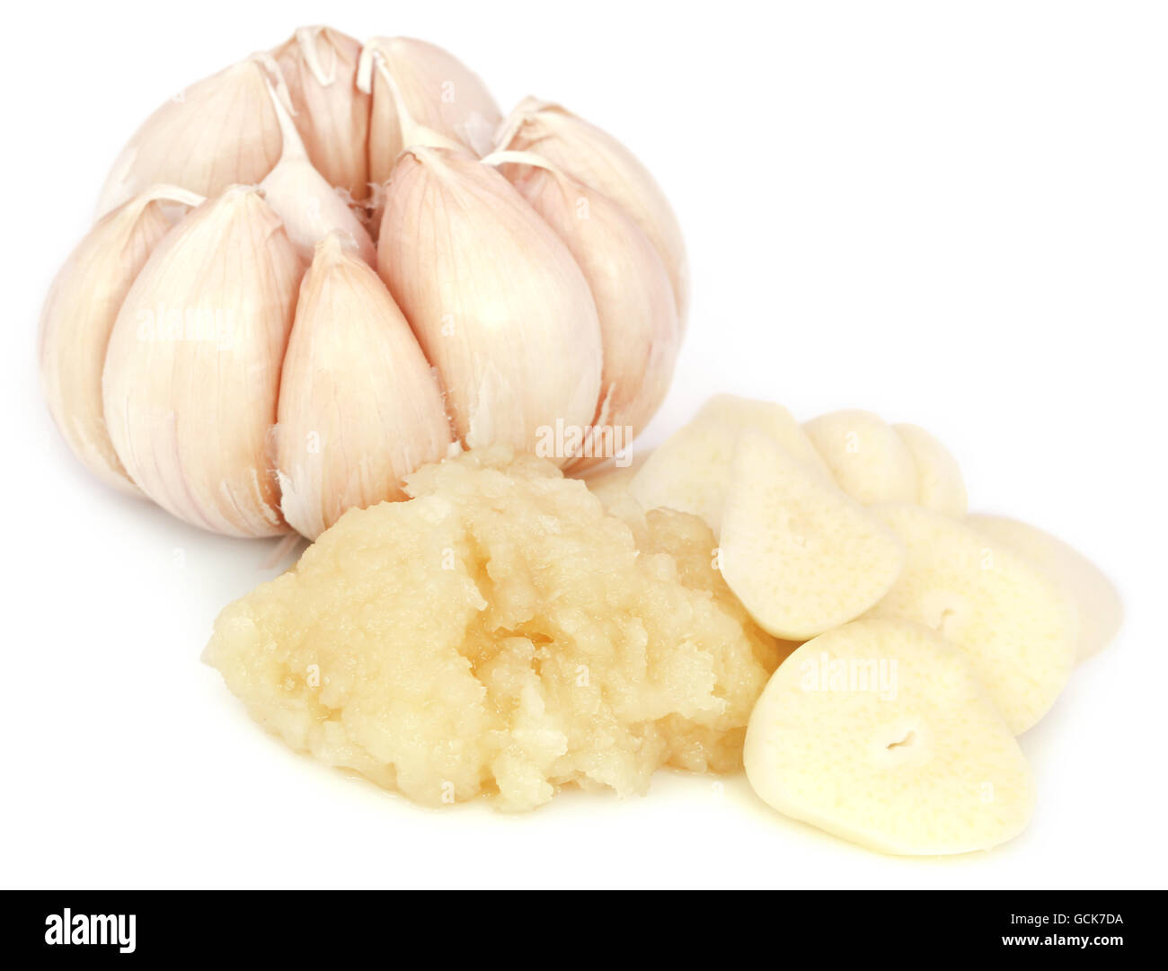 Crushed garlic with fresh ones over white background Stock Photo - Alamy