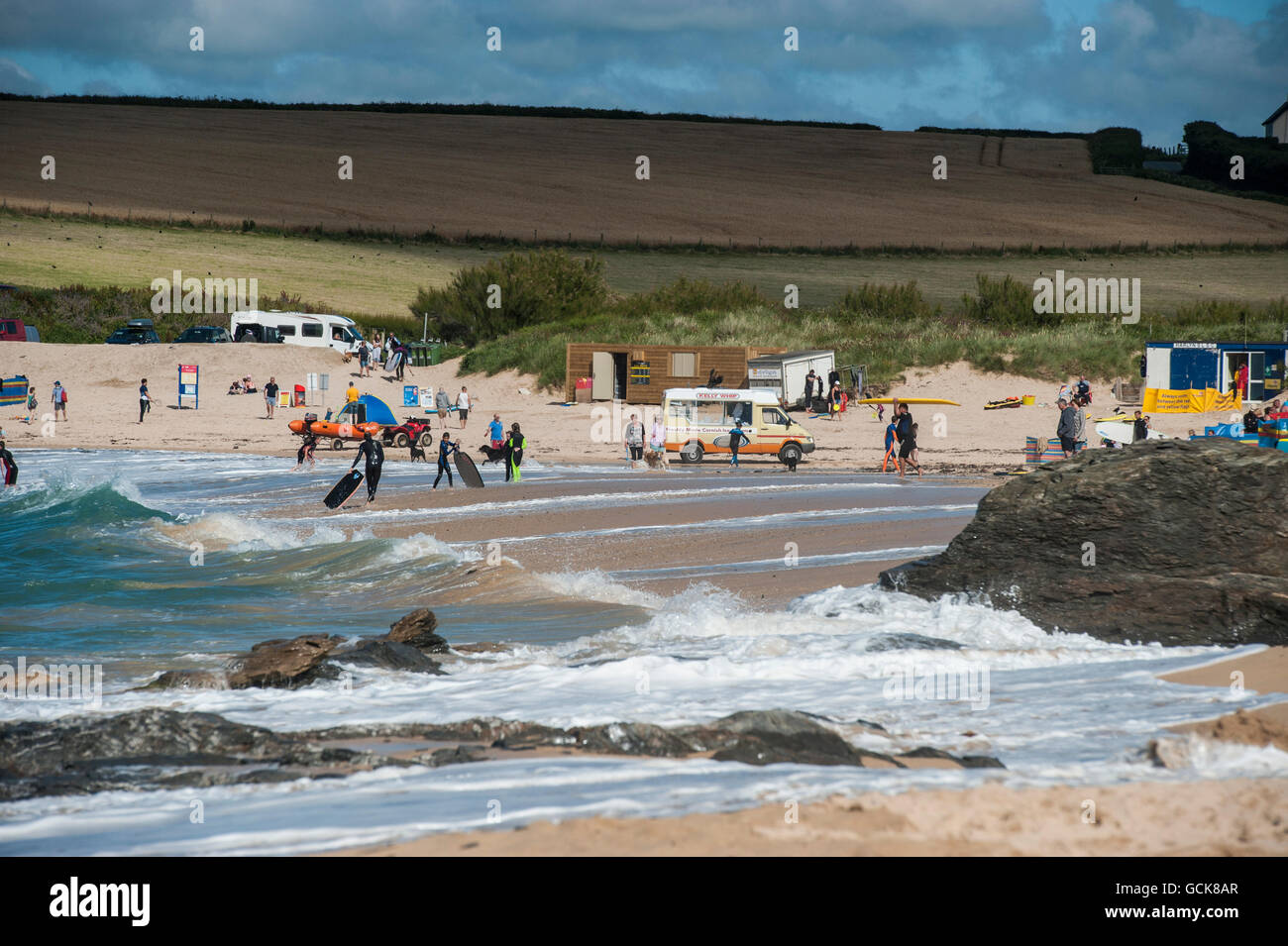 Surfing on Harwyn beach in Cornwall Stock Photo - Alamy