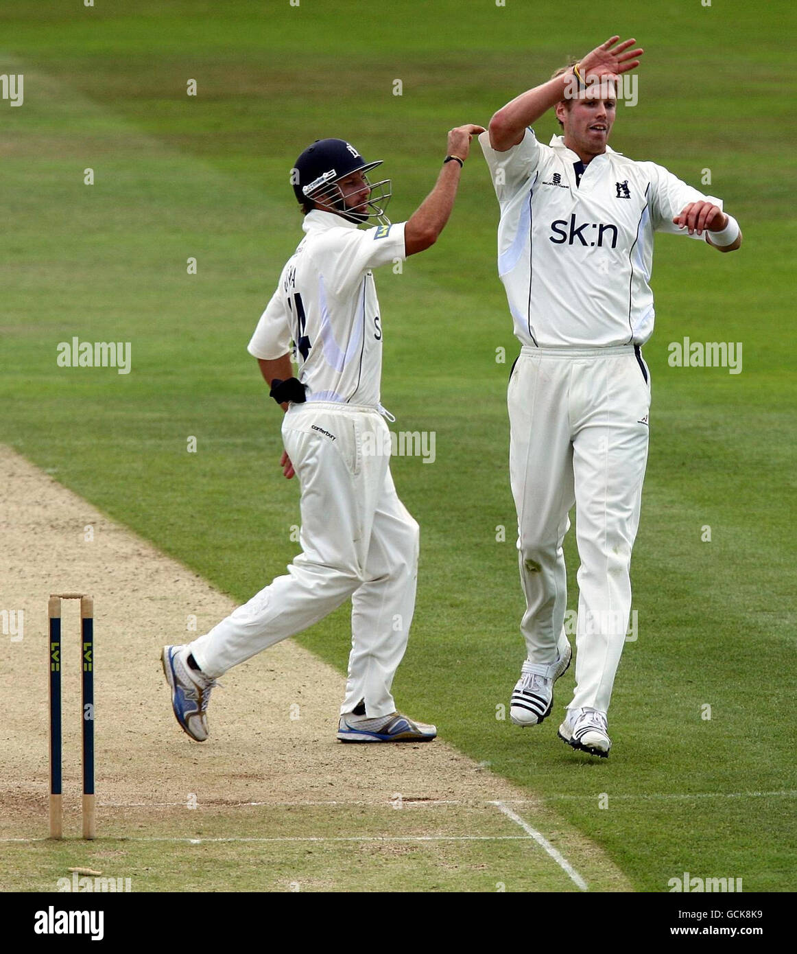 Warwickshire's Boyd Rankin celebrates with Ant Botha after bowling ...