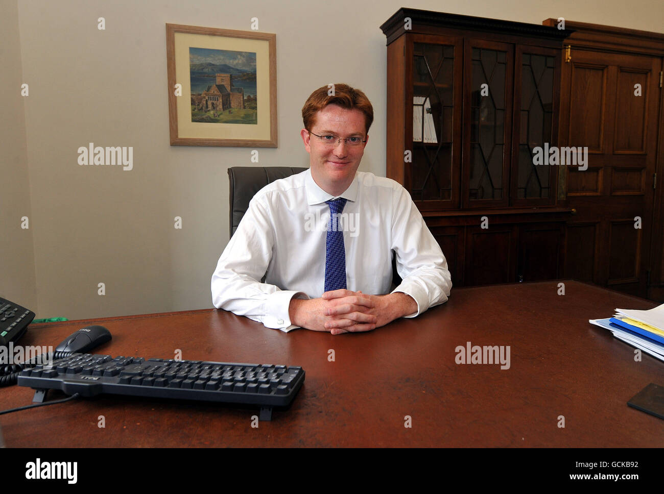 Chief Secretary to the Treasury Danny Alexander MP sits at his desk in ...