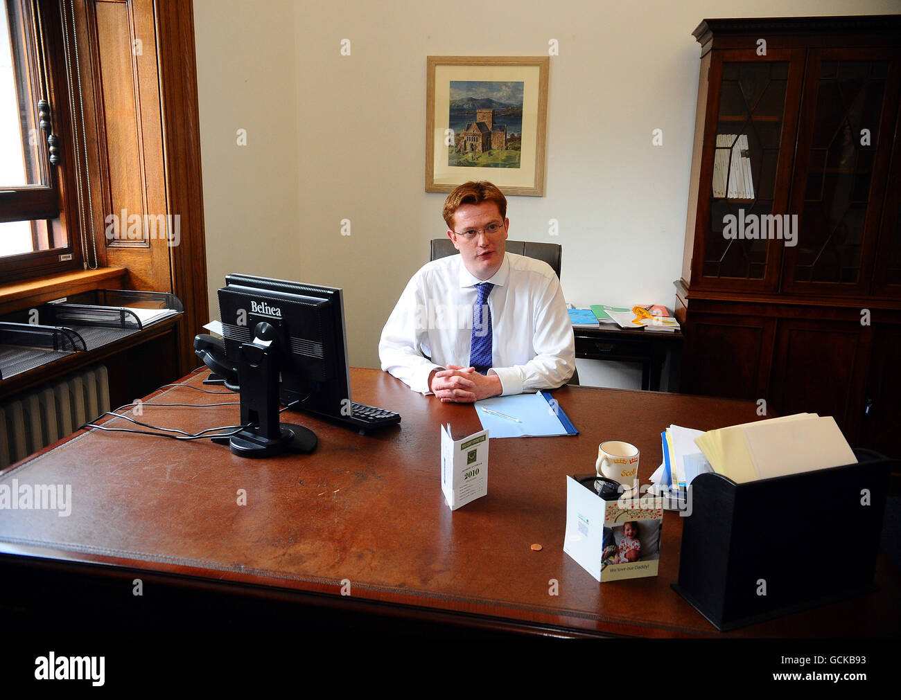 Chief Secretary to the Treasury Danny Alexander MP sits at his desk in ...