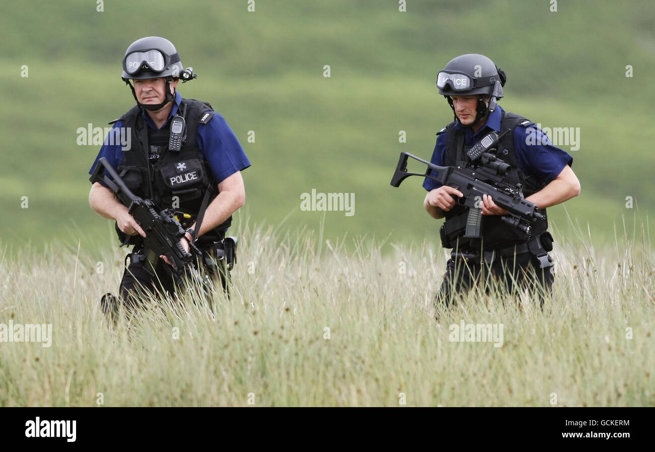 Police officers search the area near North Riding Farm, Northumberland ...
