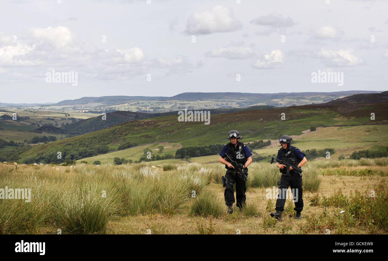 Police officers search the area near North Riding Farm, Northumberland ...