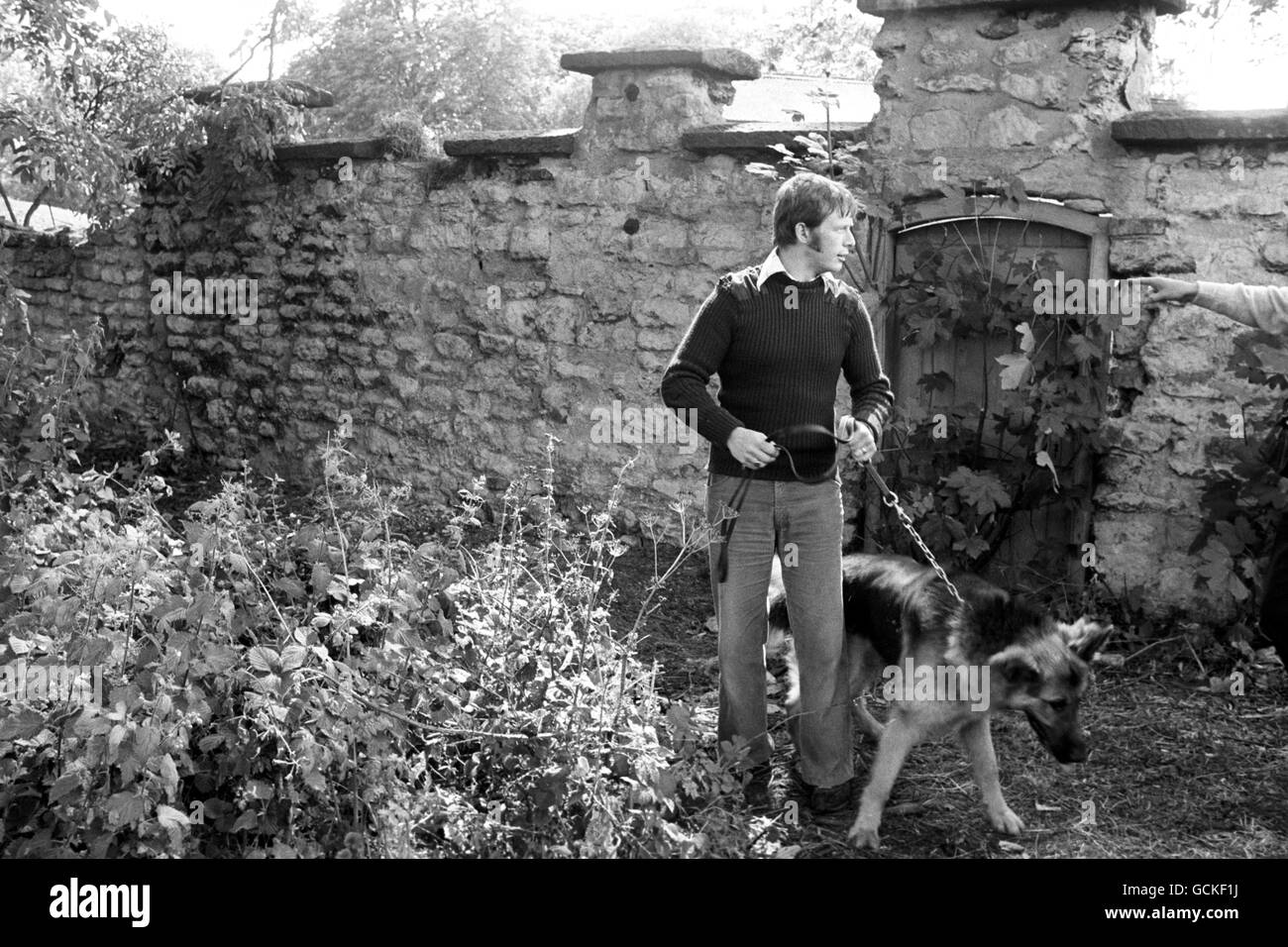 A police dog handler at work near the spot where triple killer Barry ...