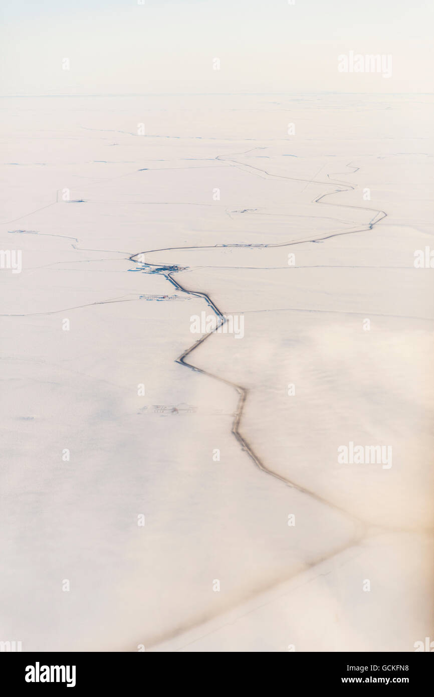 Aerial view of roads and other oil infrastructure on the Arctic tundra ...