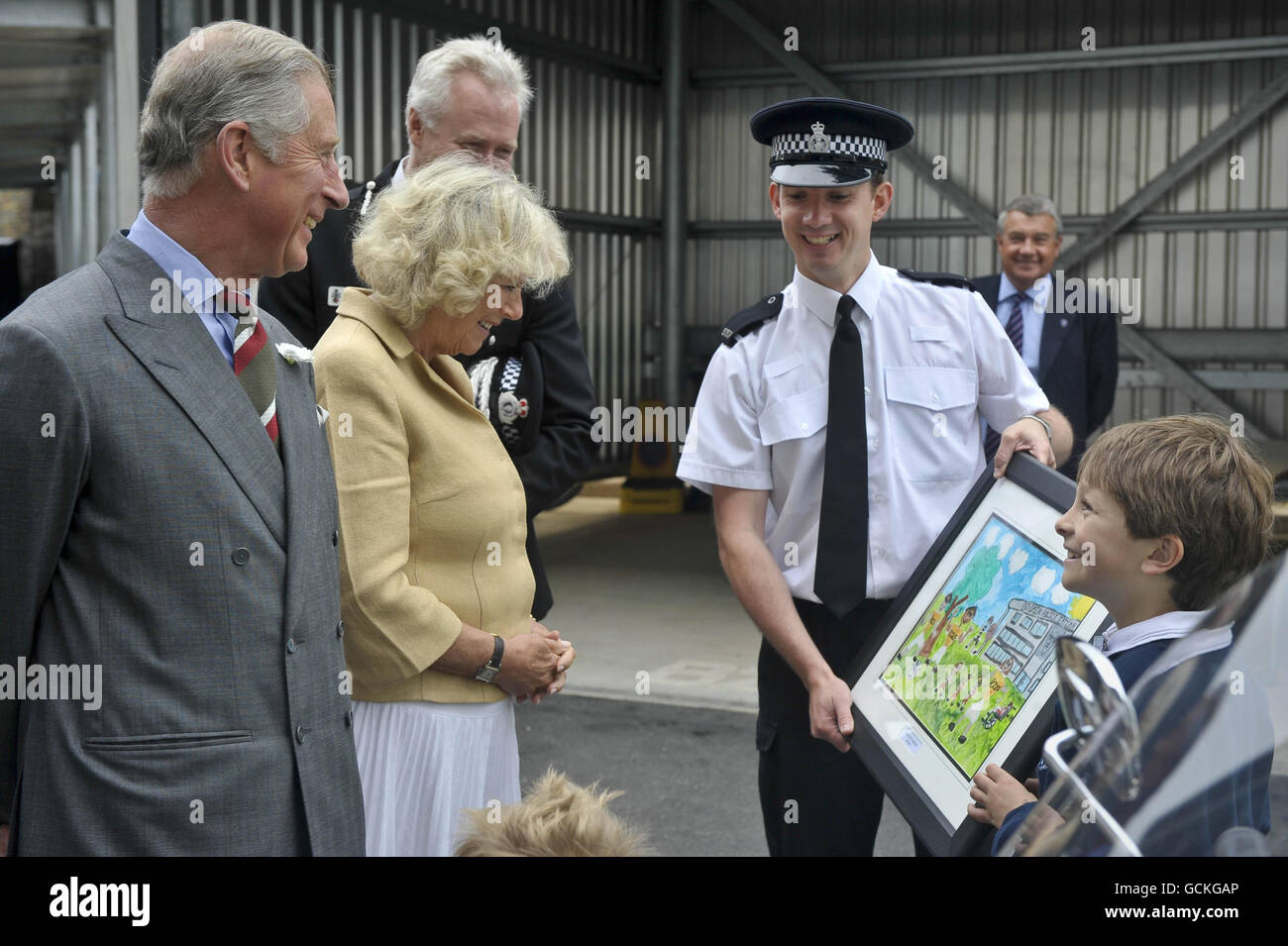 The Prince of Wales and Duchess of Cornwall talk to young painting ...
