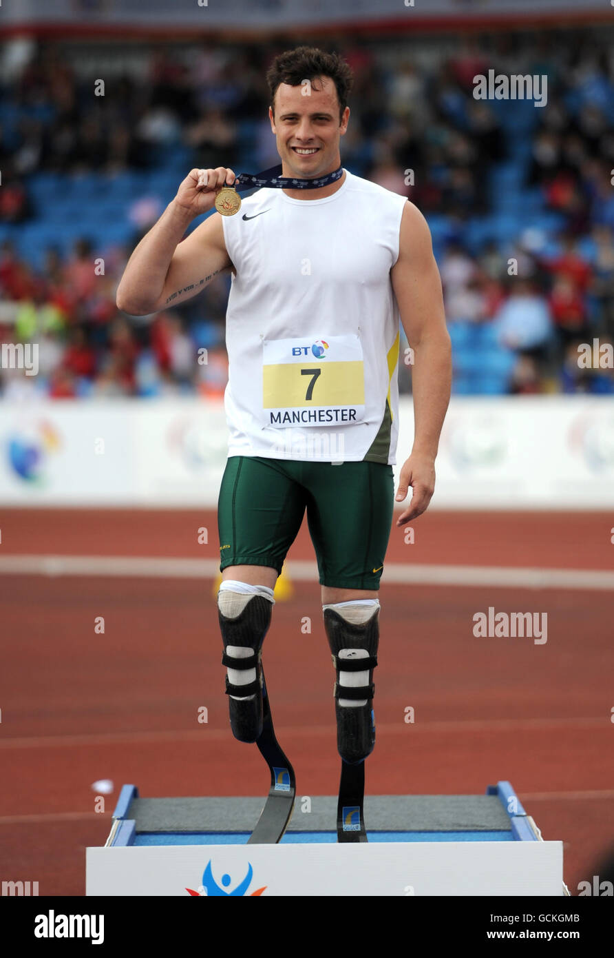 South Africa's Oscar Pistorius poses with his gold medal aftere winning ...