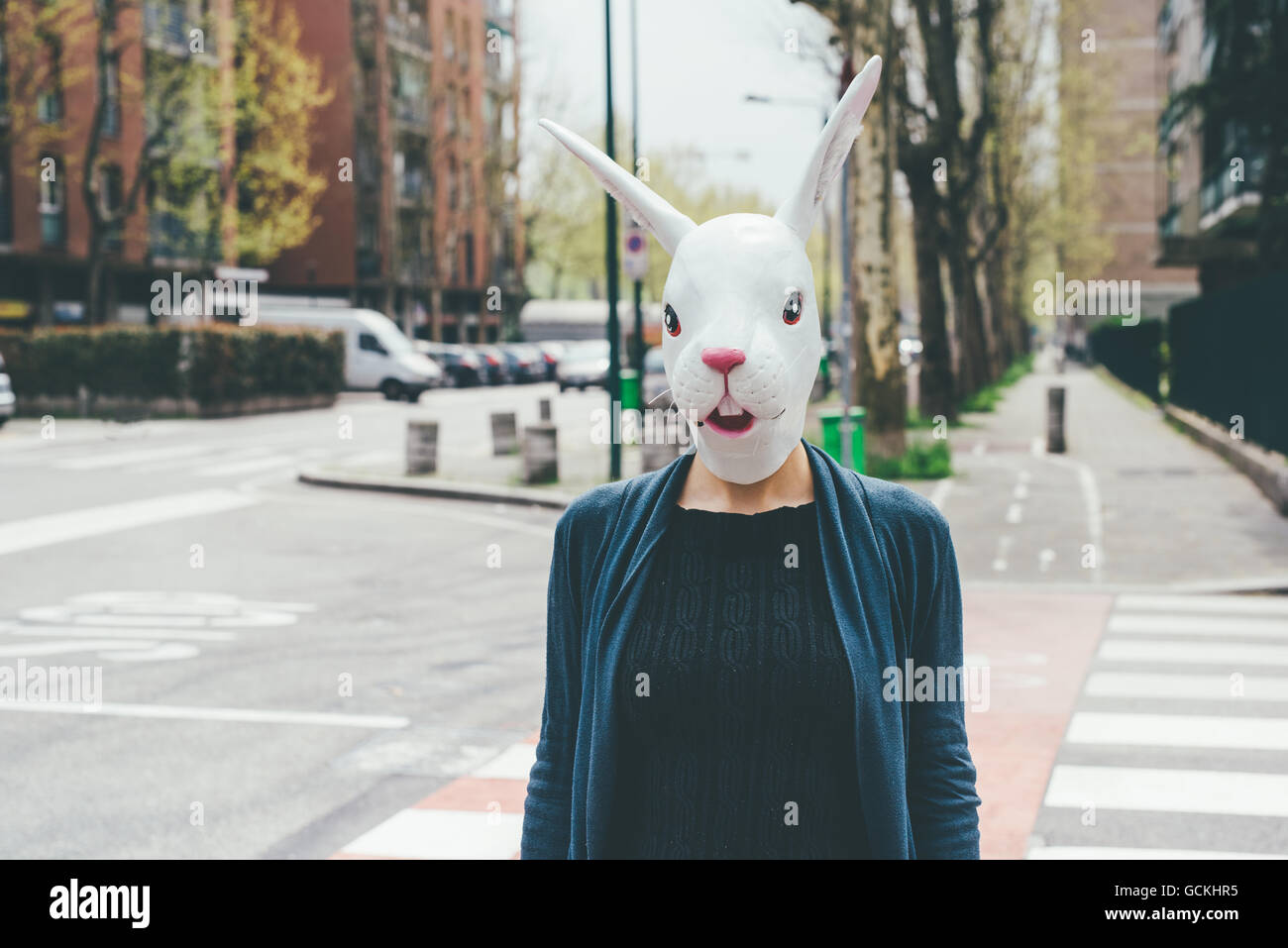 Half length woman wearing rabbit mask outdoor in the city - halloween ...
