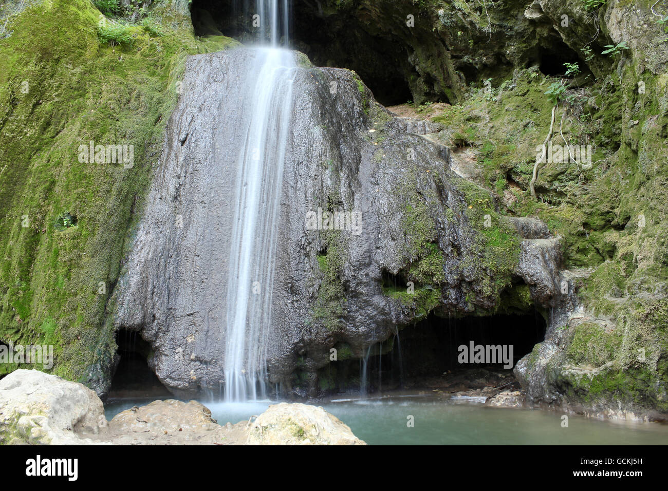 waterfall and cave nature scene Stock Photo - Alamy