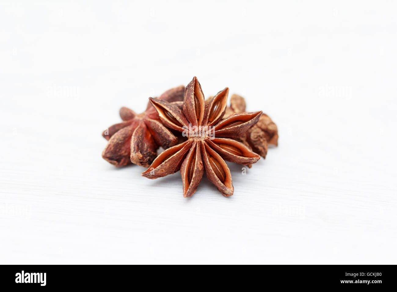 Stars of anise isolated on white background Stock Photo - Alamy