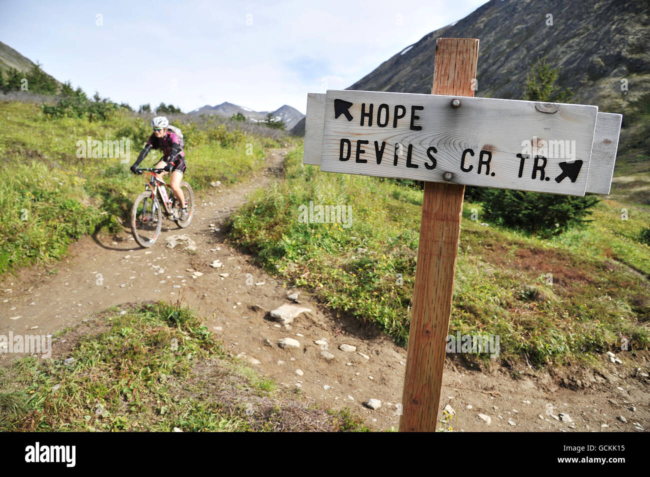 Woman rides a full suspension mountain bike on the Devils Pass Trail in ...