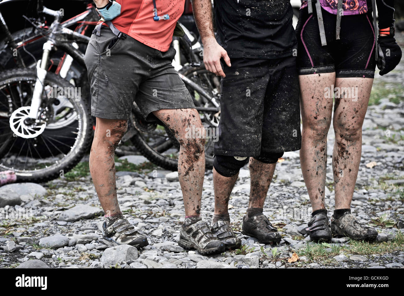 Close up of muddy mountain bikers after a long ride on the Resurrection ...