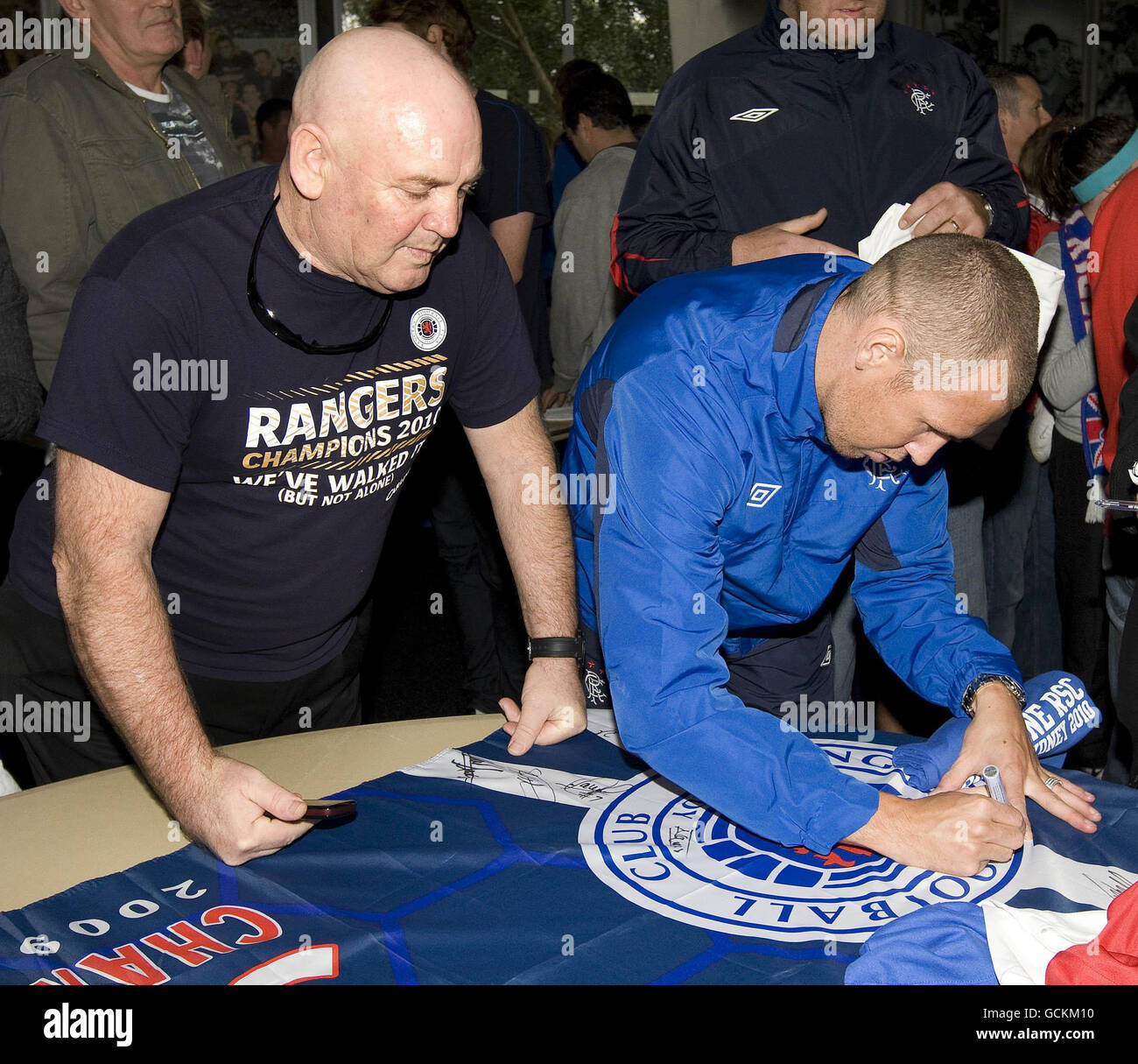 Rangers' Kyle Lafferty signs his autograph for a fan from the Oceana ...
