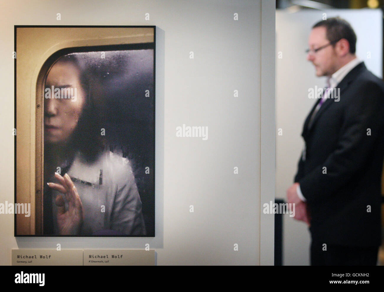 A members of the public views a photo from the World Press Photo ...
