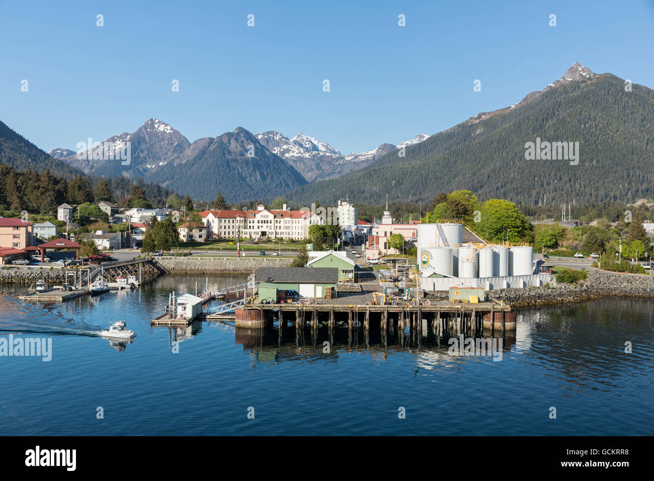 View of the pier and Sitka harbor with the Three Sisters mountains in ...