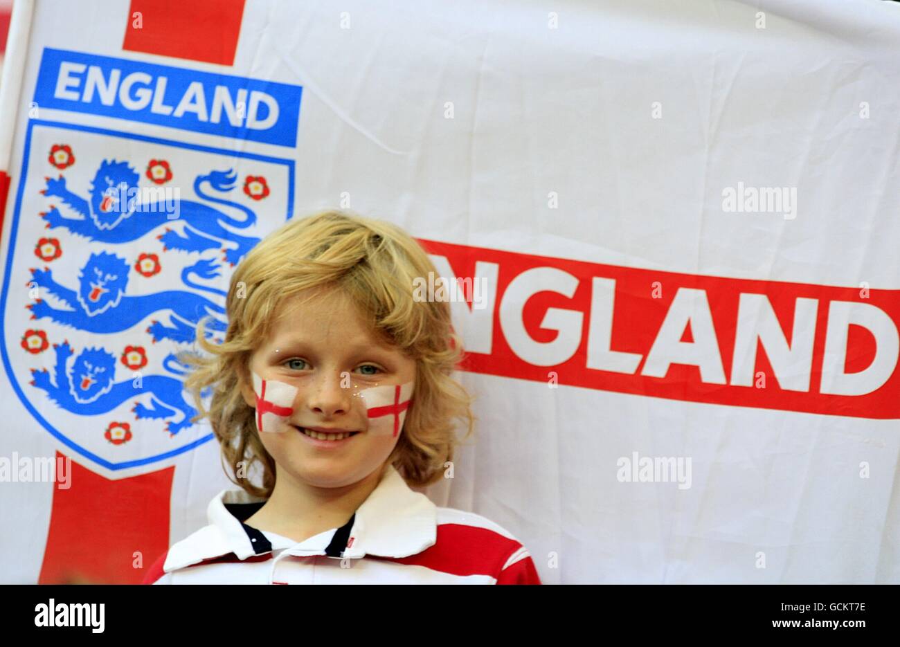 A young England fans sits with a painted face in the stands Stock Photo ...