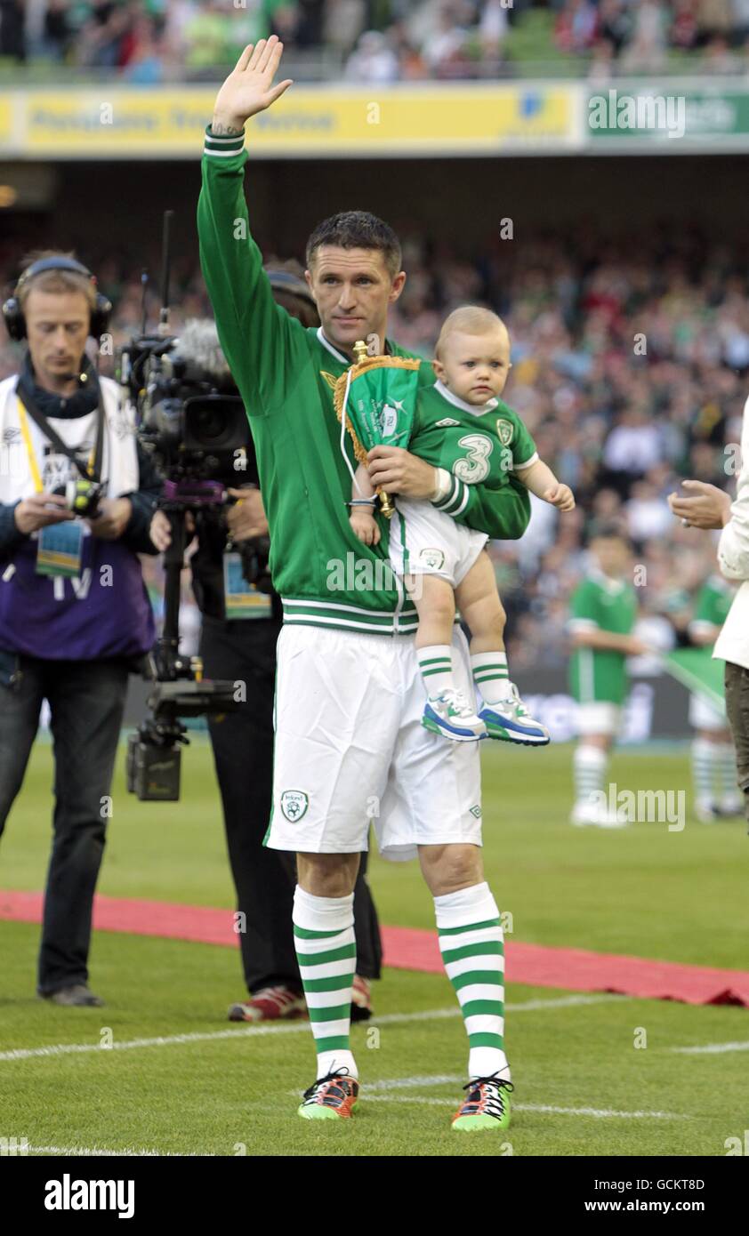 Republic of Ireland's Robbie Keane aknowledges the crowd with his son ...