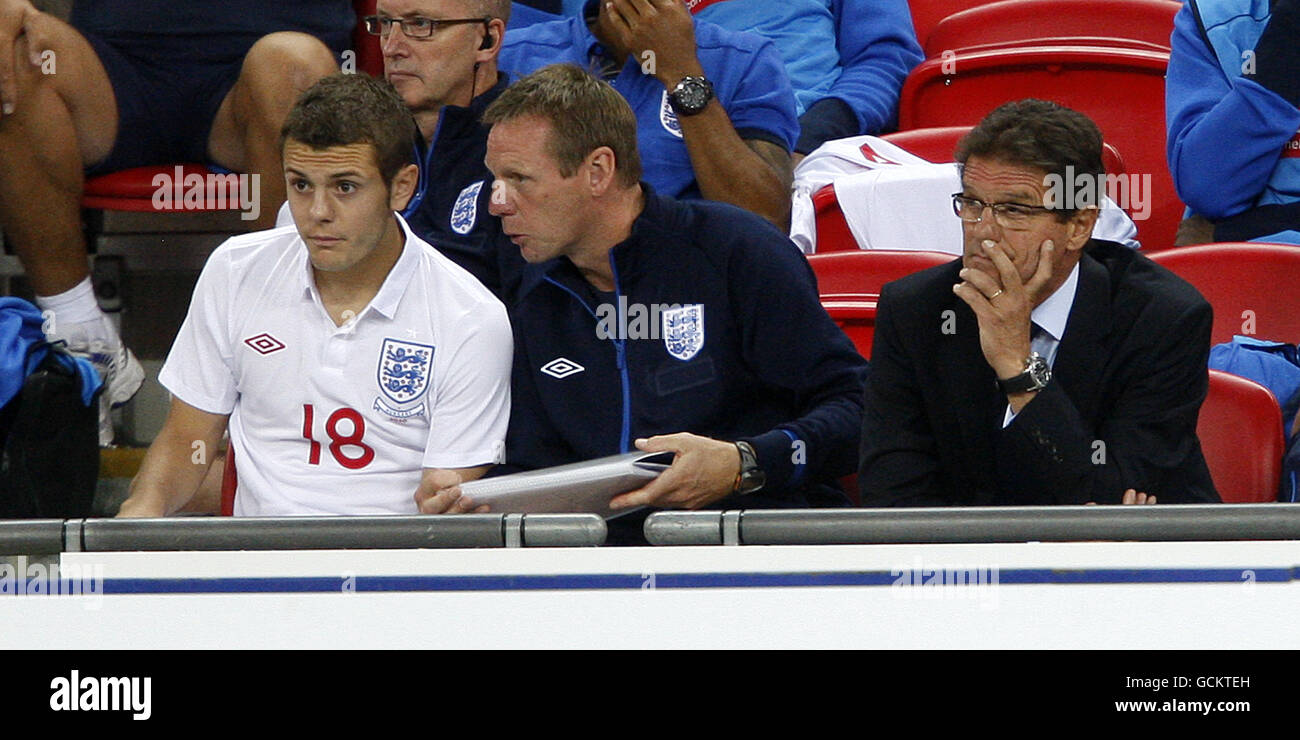 England coach Stuart Pearce (C) gives instructions to Jack Wilshere (L ...