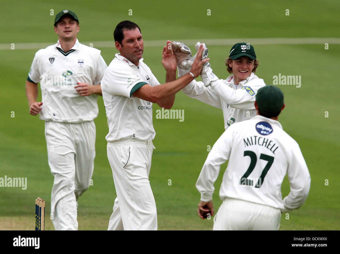 Worcestershire's Matt Mason (second left) celebrates with wicket keeper ...