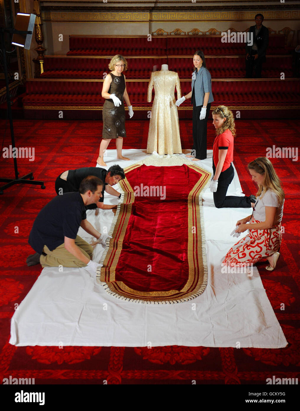 Royal Collection staff with Queen Elizabeth II's Robe of State in the ...