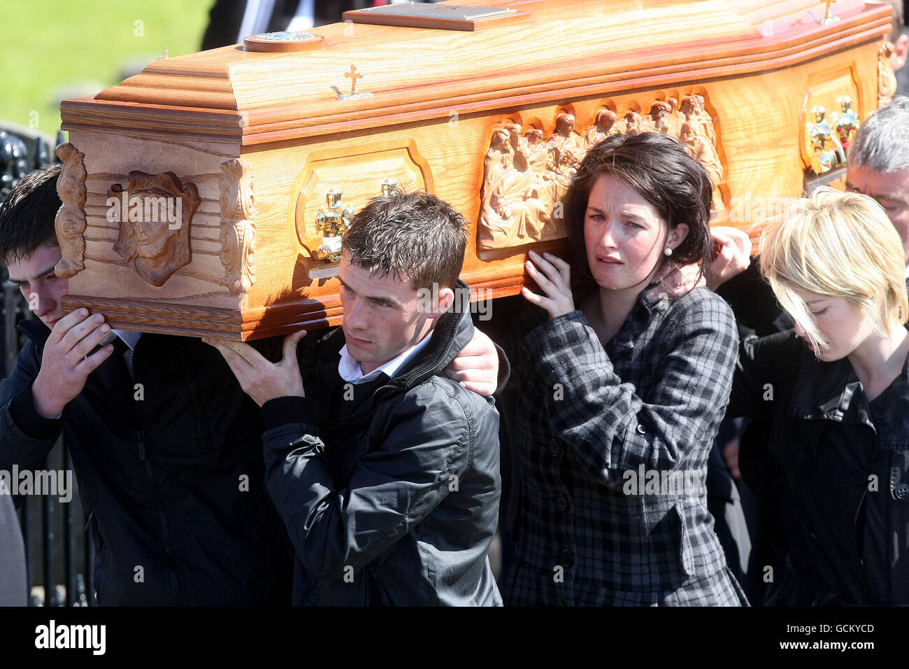 The coffin of Patrick 'PJ' McLaughlin is carried from his funeral ...