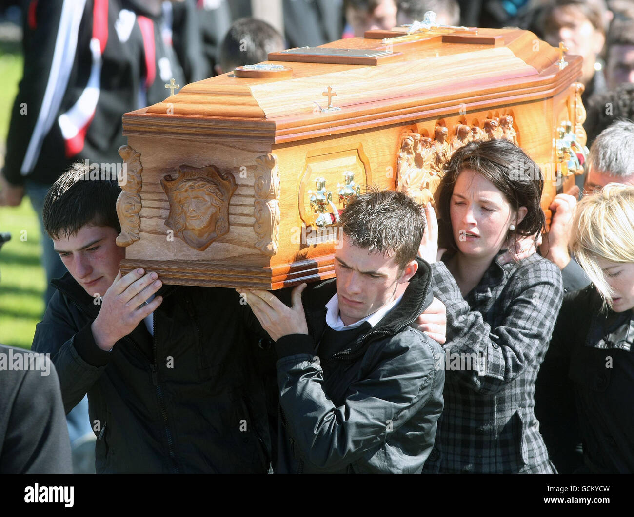 The coffin of Patrick 'PJ' McLaughlin is carried from his funeral ...