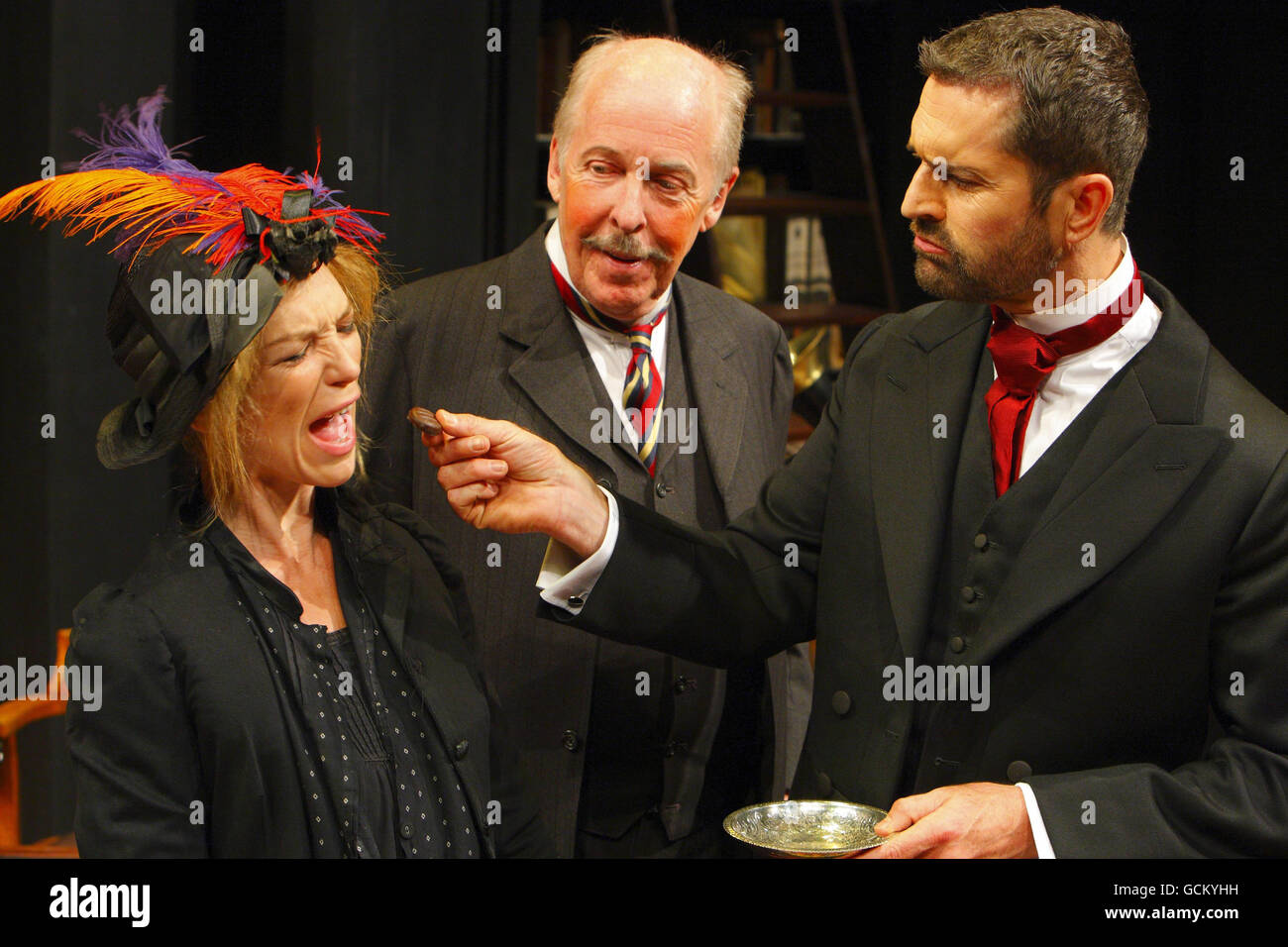 Rupert Everett as Professor Henry Higgins (right), Peter Eyre as ...