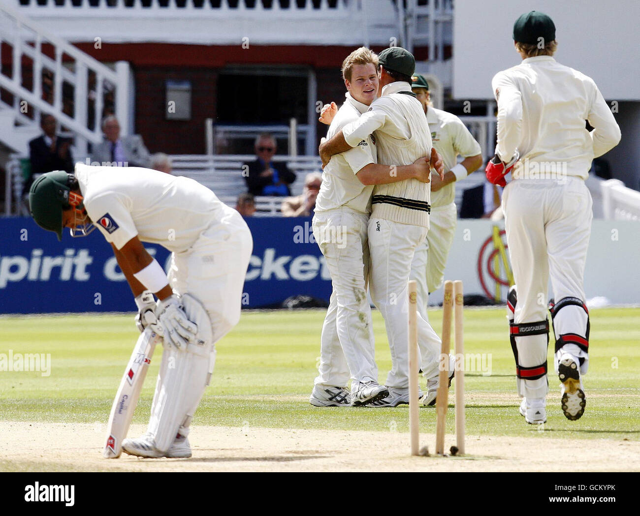 Pakistan's Kamran Akmal (left) is bowled by Australia's Steven Smith ...