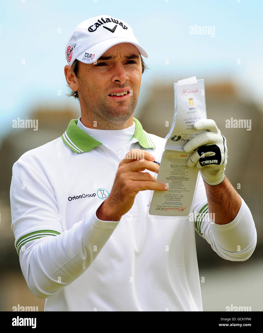 England's Oliver Wilson checks the yardage during round two of The Open ...