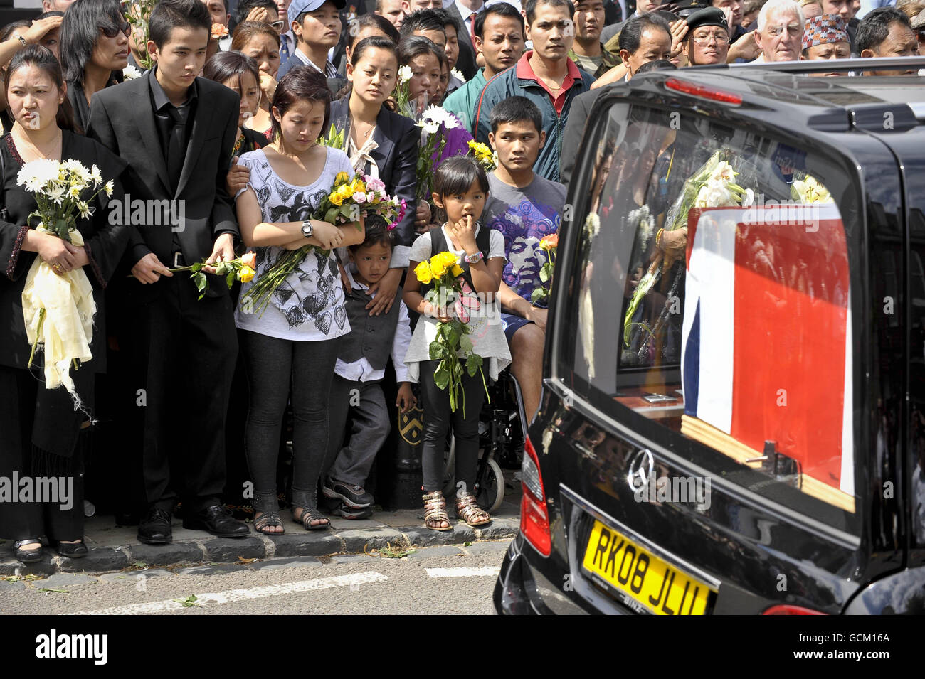 The family of Corporal Arjun Purja Pun, watch as hearses make their way ...
