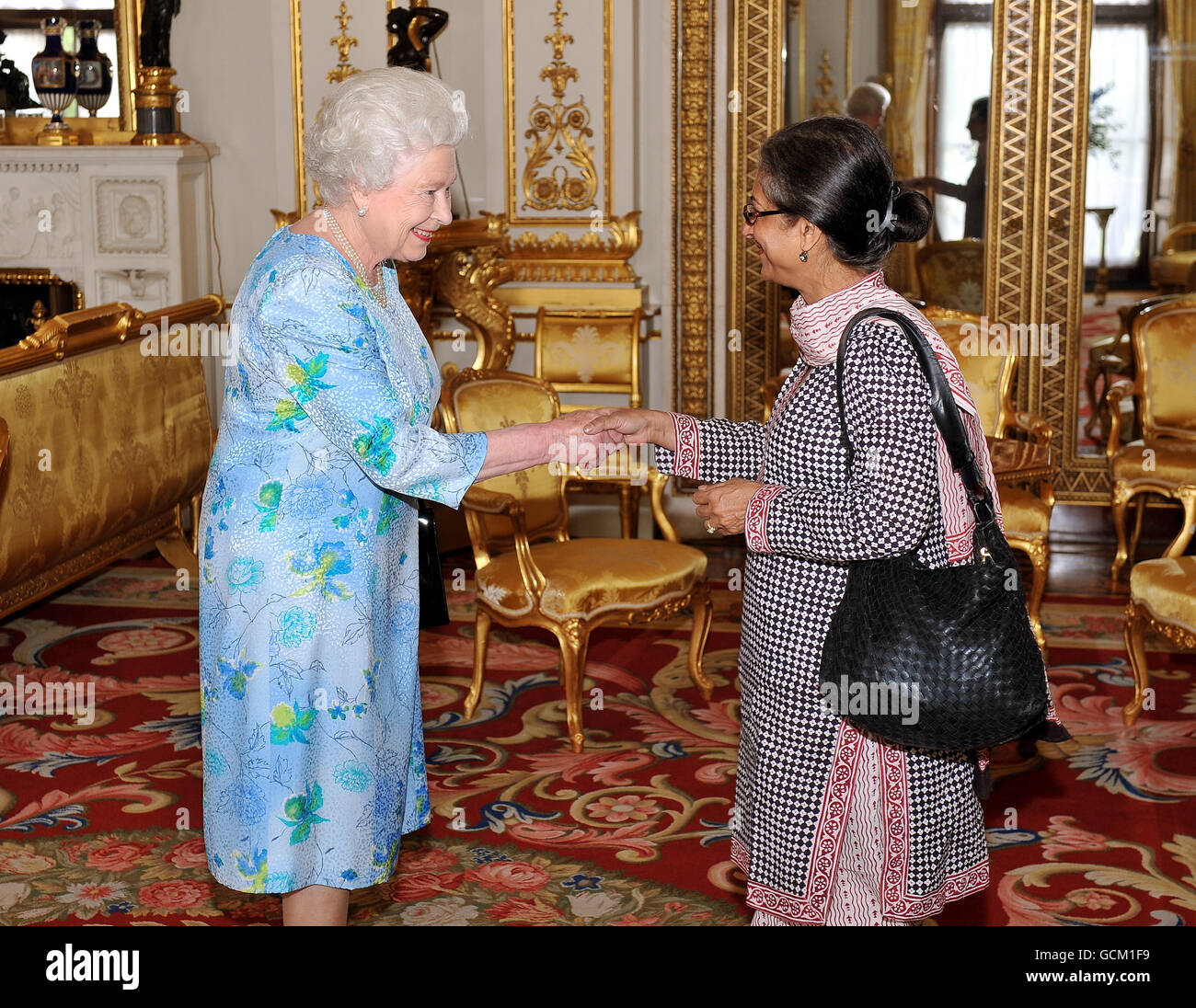 The Queen shakes hands with Dr Asma Jahangir of Pakistan, during a ...