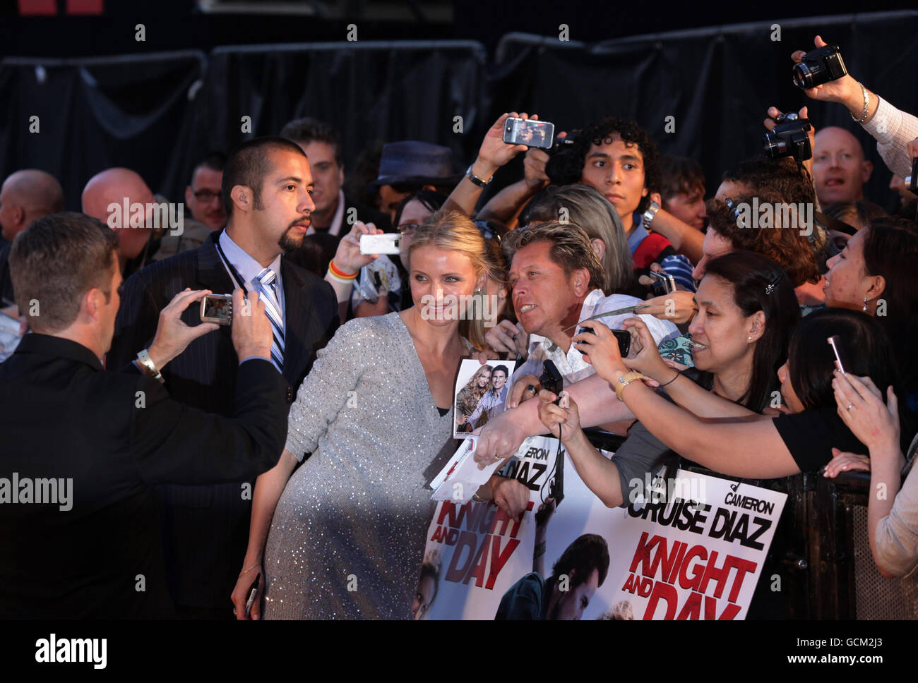Cameron Diaz poses for photographs with fans as she arrives at the ...