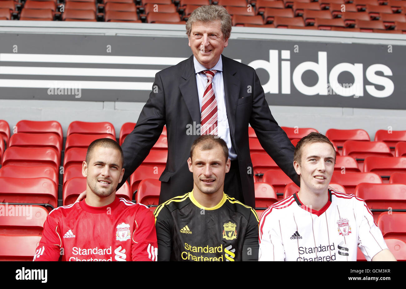 Liverpool's new signings Joe Cole (left), manager Roy Hodgson, Milan ...