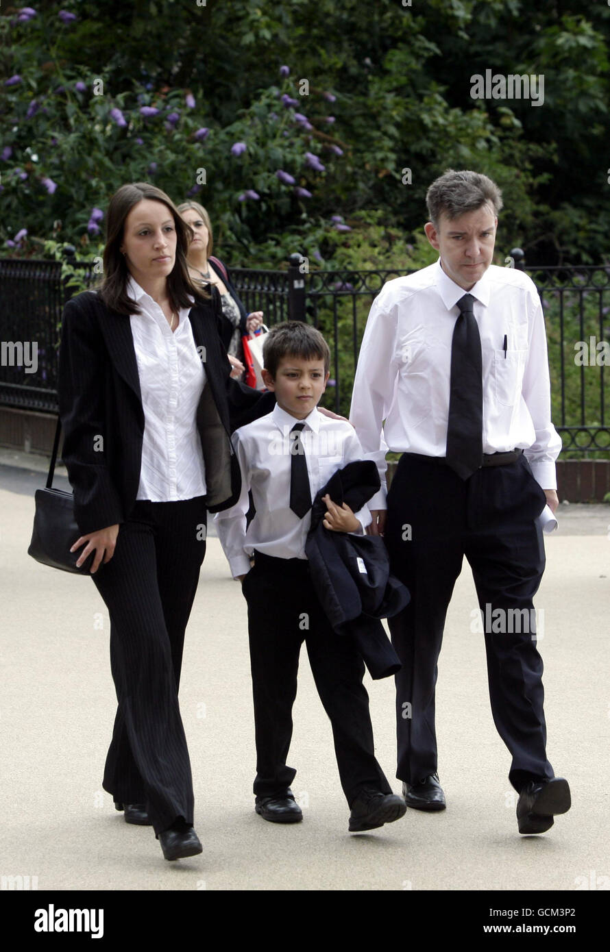 Ricky Edwards the husband of Panumad Edwards, arrives with their son ...