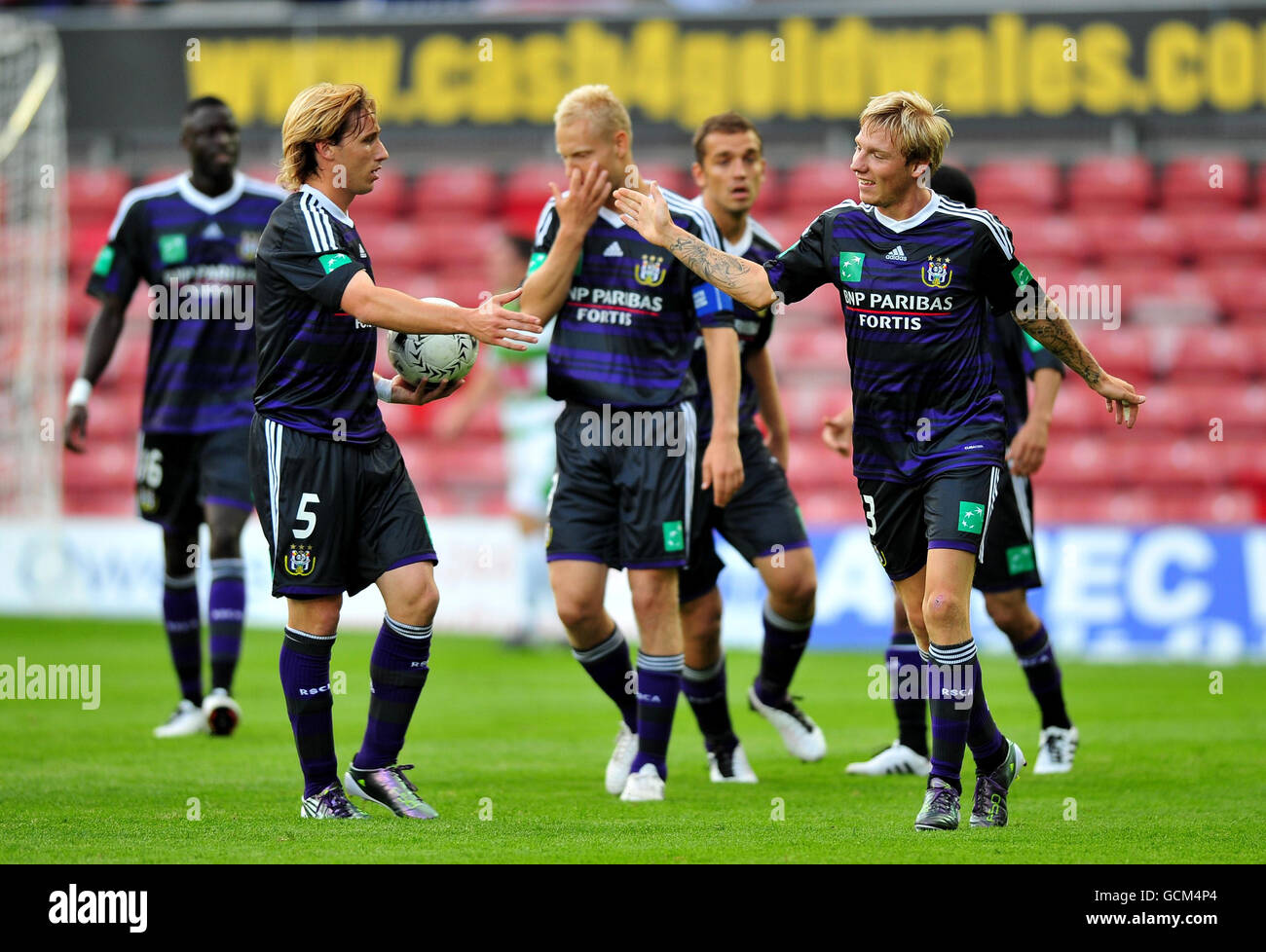 RSC Anderlecht's Jonathan Legear (right) is congratulated by his team ...