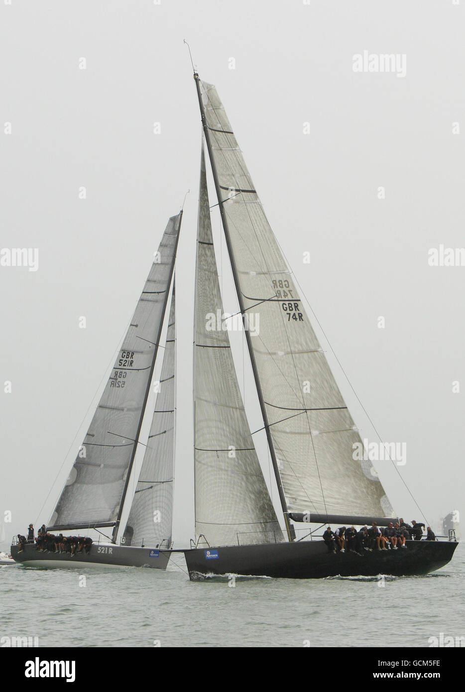 Sir peter ogden steers new yacht jethou right past bob hi-res stock ...