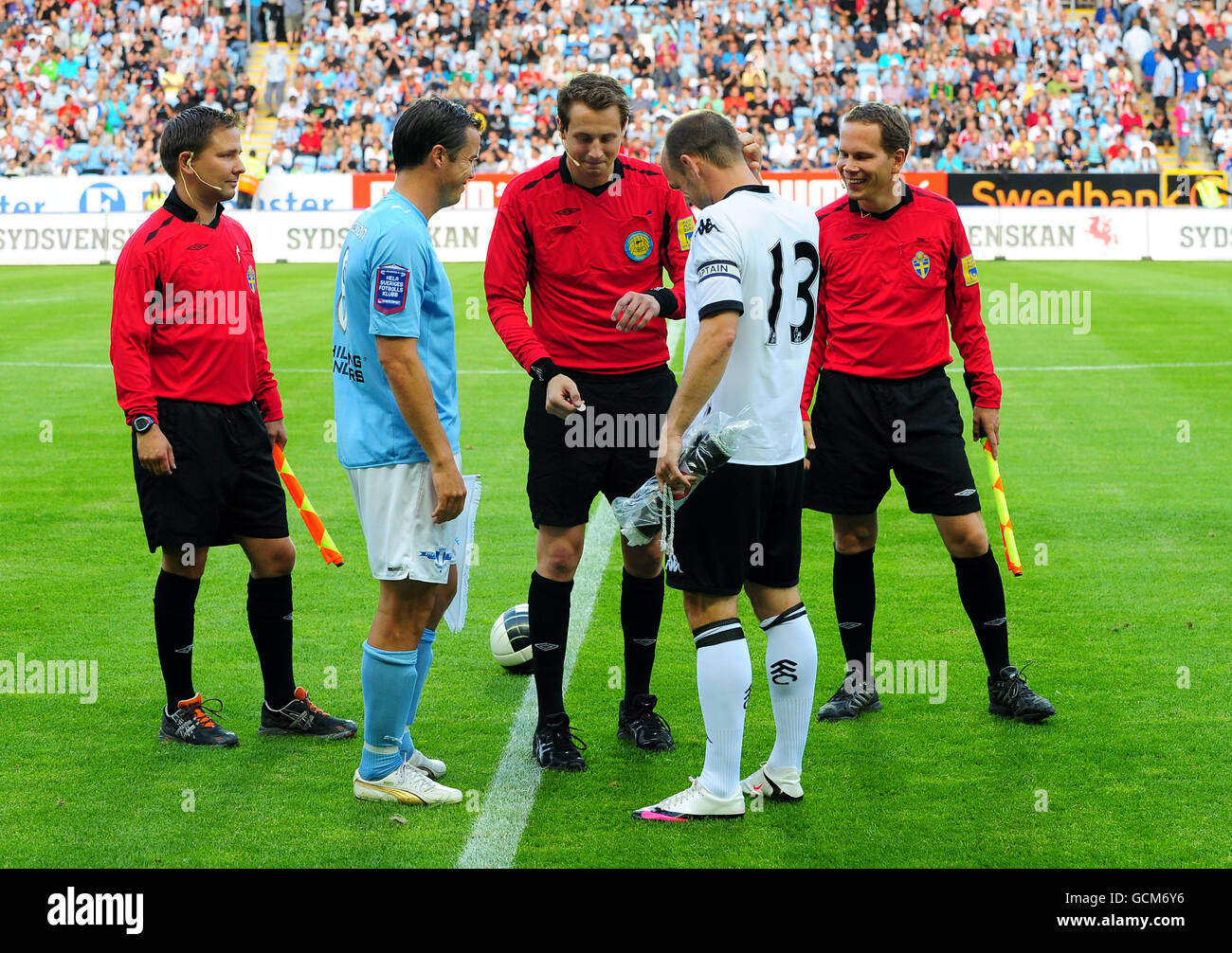The referee conducts the coin toss hi-res stock photography and images ...